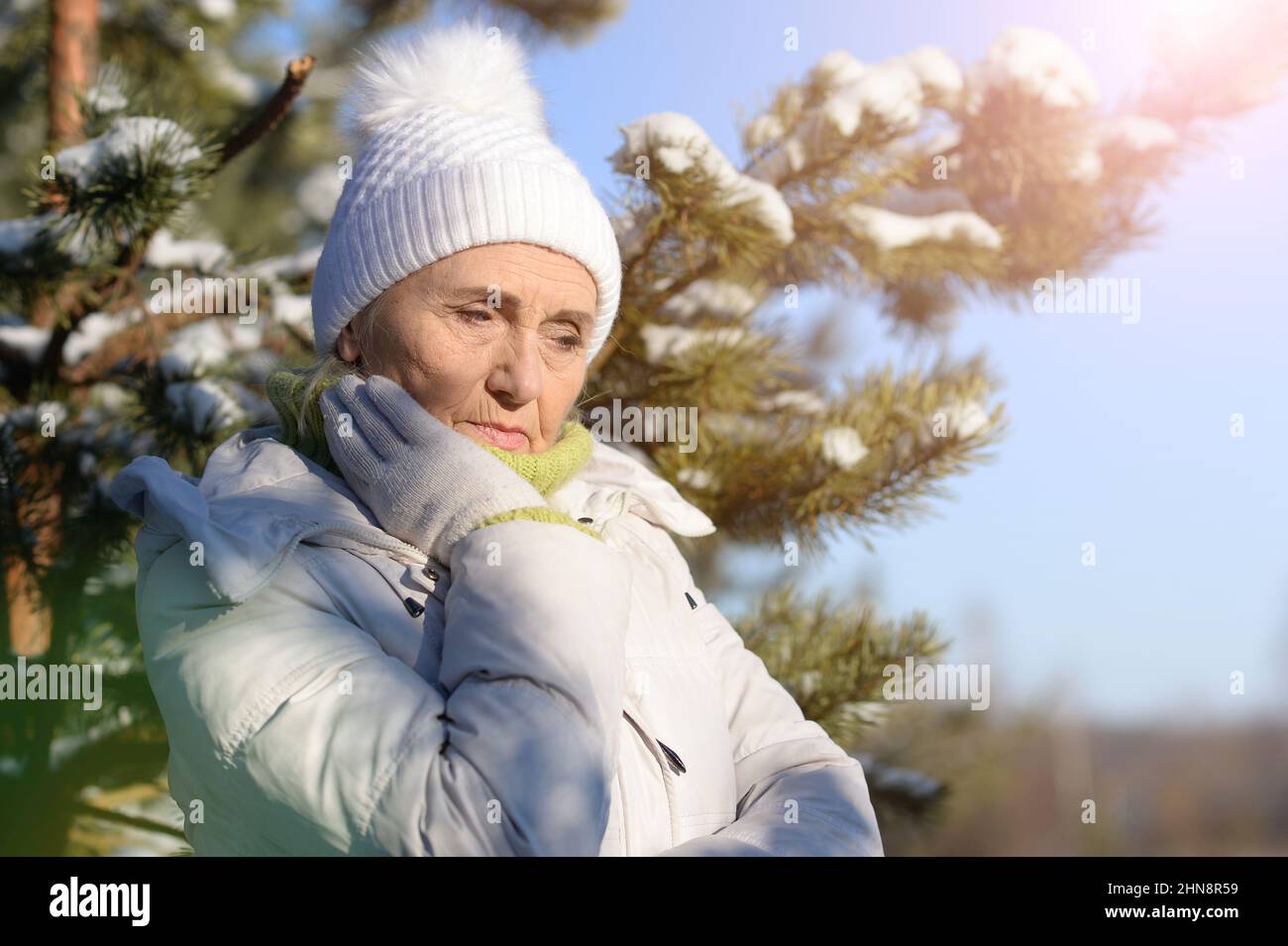 Old woman in snow sad hi-res stock photography and images - Alamy