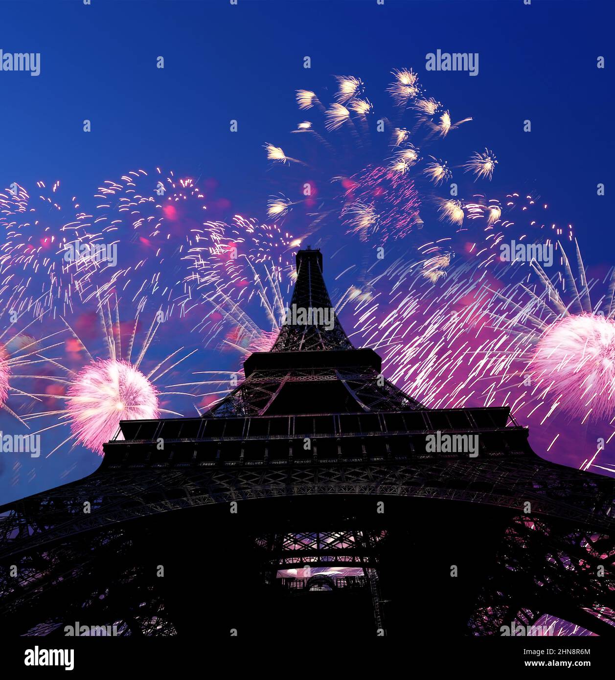 Celebratory colorful fireworks over the Eiffel Tower in Paris, France ...