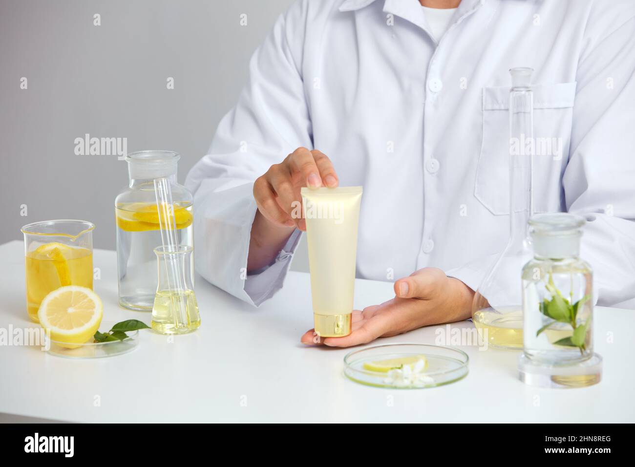 Lemon extract with sliced lemon transparent podium in laboratory ...