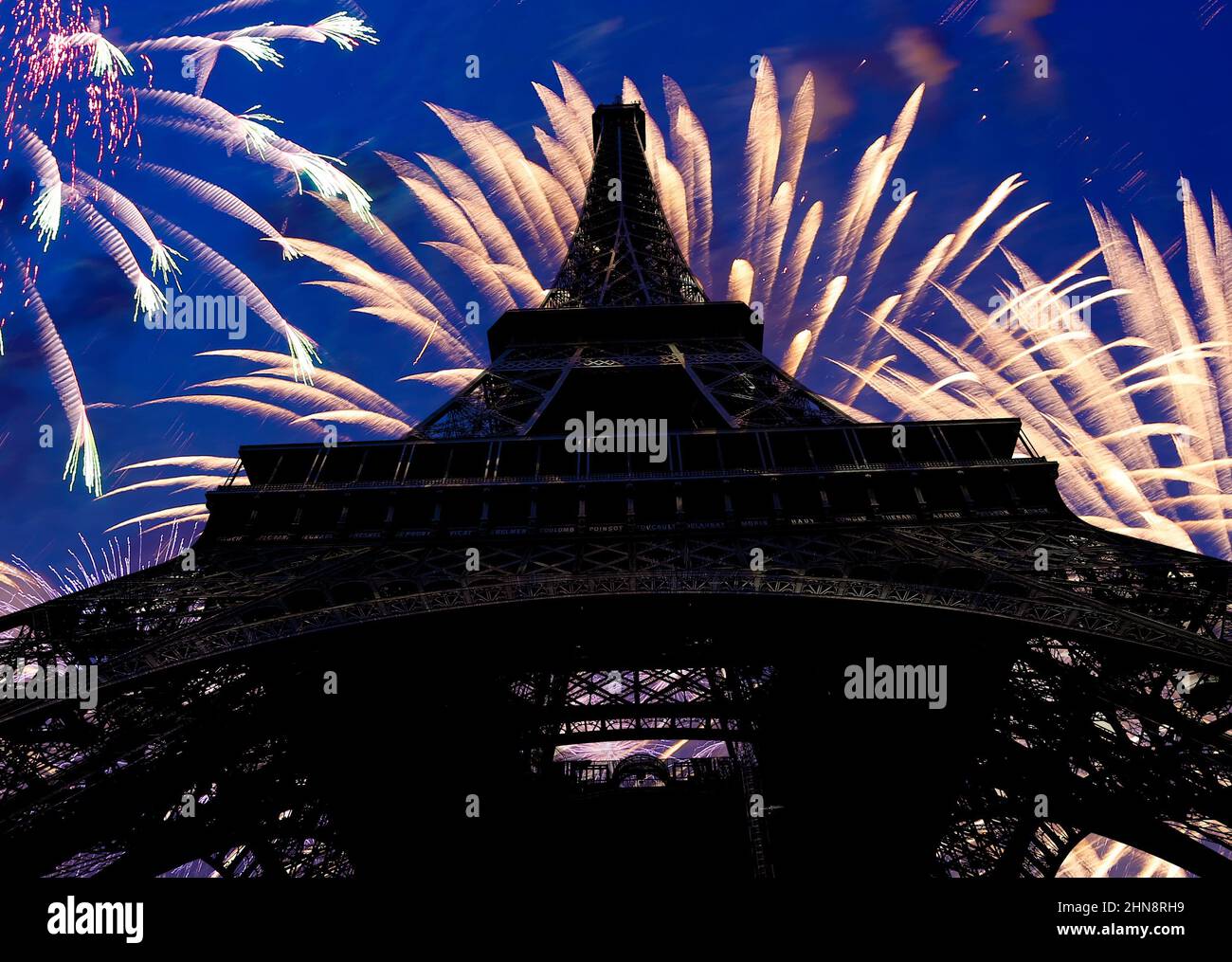Celebratory colorful fireworks over the Eiffel Tower in Paris, France ...
