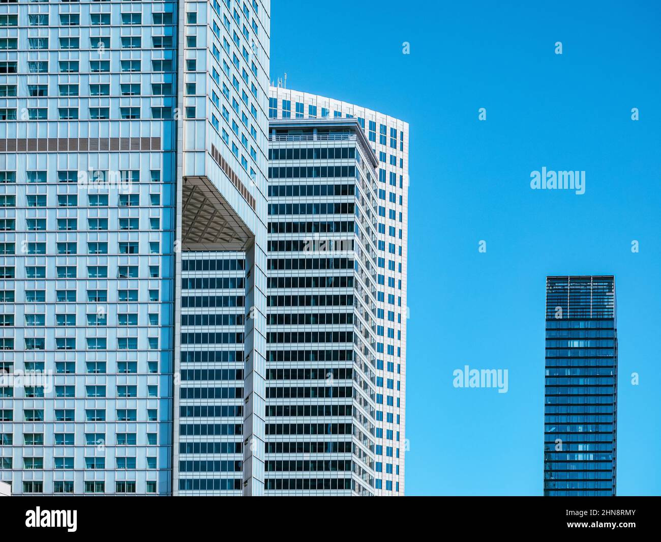 front view on modern white skyscrapers over blue sky background Stock ...