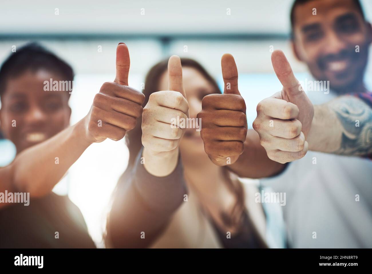Go get that success. Cropped shot of a team of colleagues showing ...
