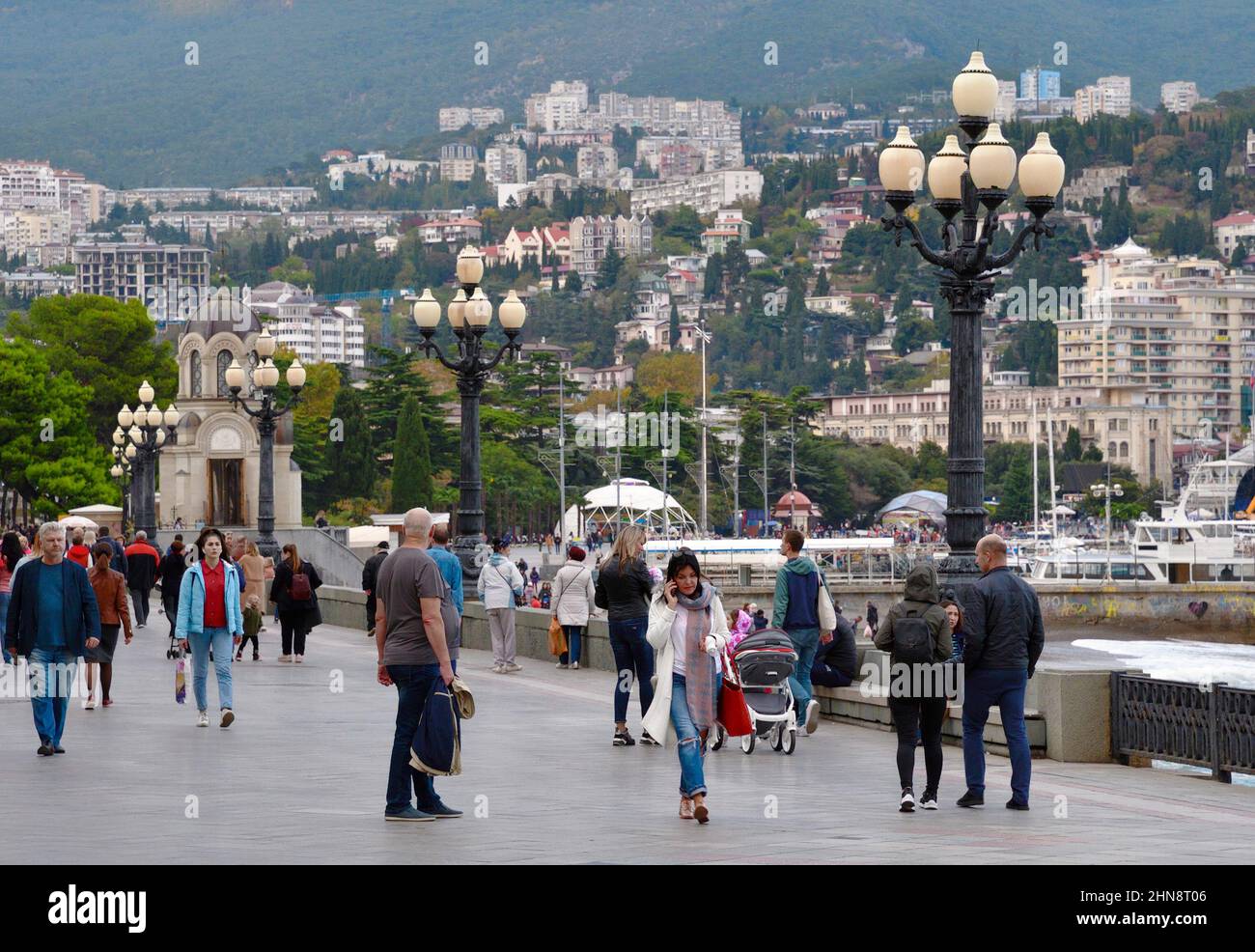 Yalta, Crimea, Russia - 05.07.2019: Vacationers walk along the main promenade of Yalta-the ...