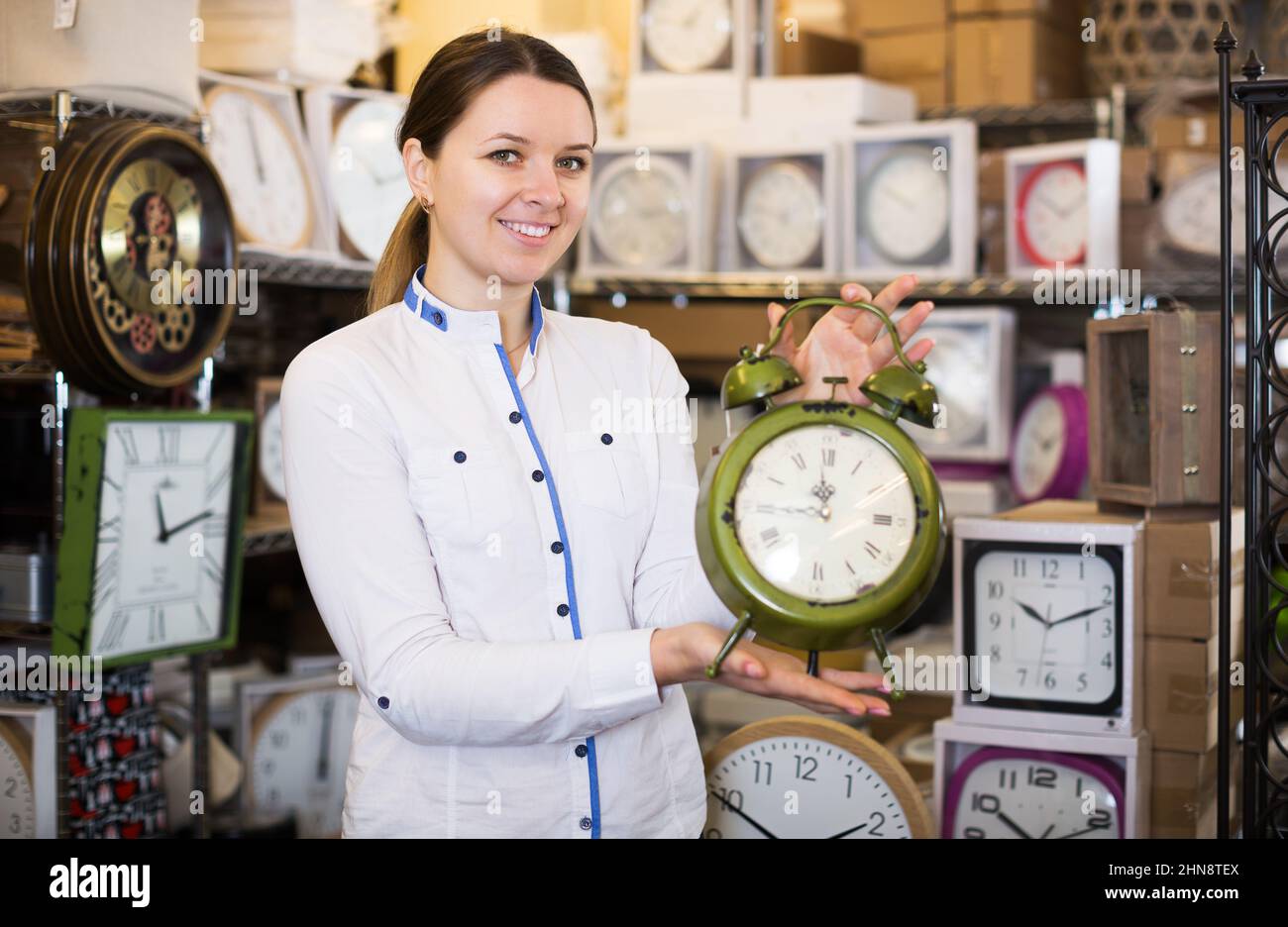 woman is holding clock Stock Photo - Alamy