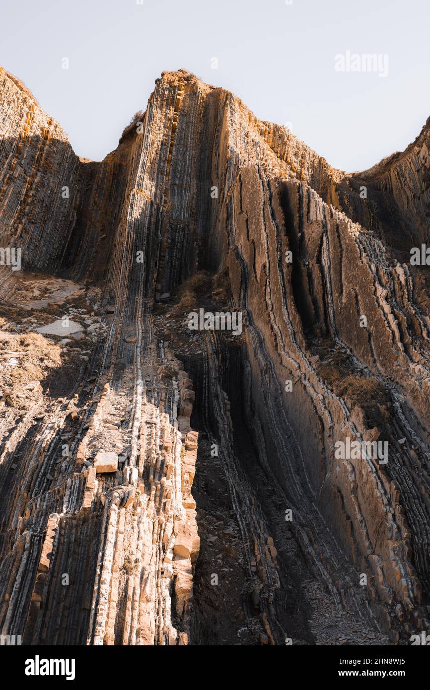 Vertical shot of a huge cliff in the daytime. Perfect for wallpaper ...