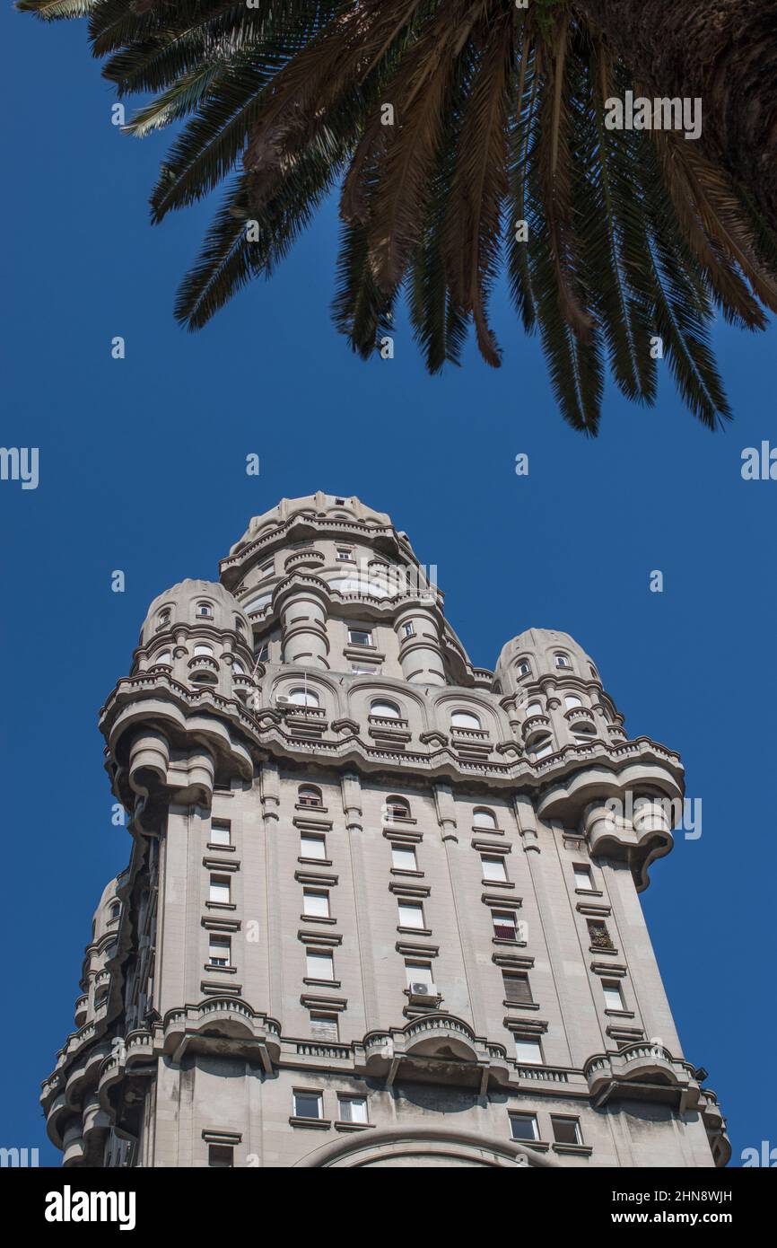 Vertical low angle shot of a gray tower with beautiful balconies in ...