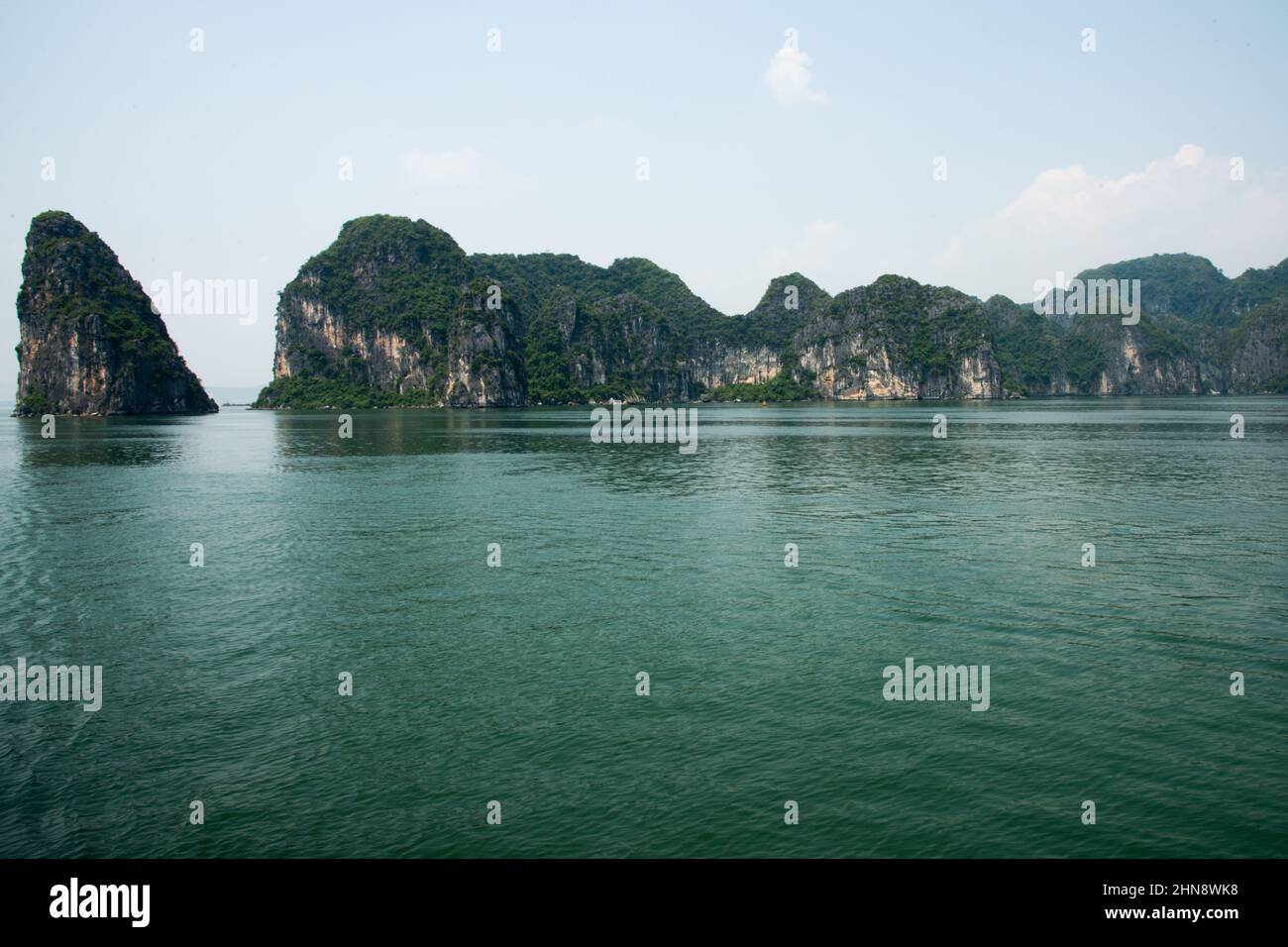 Scenic view of the emerald water and cliffs covered in green forests of ...