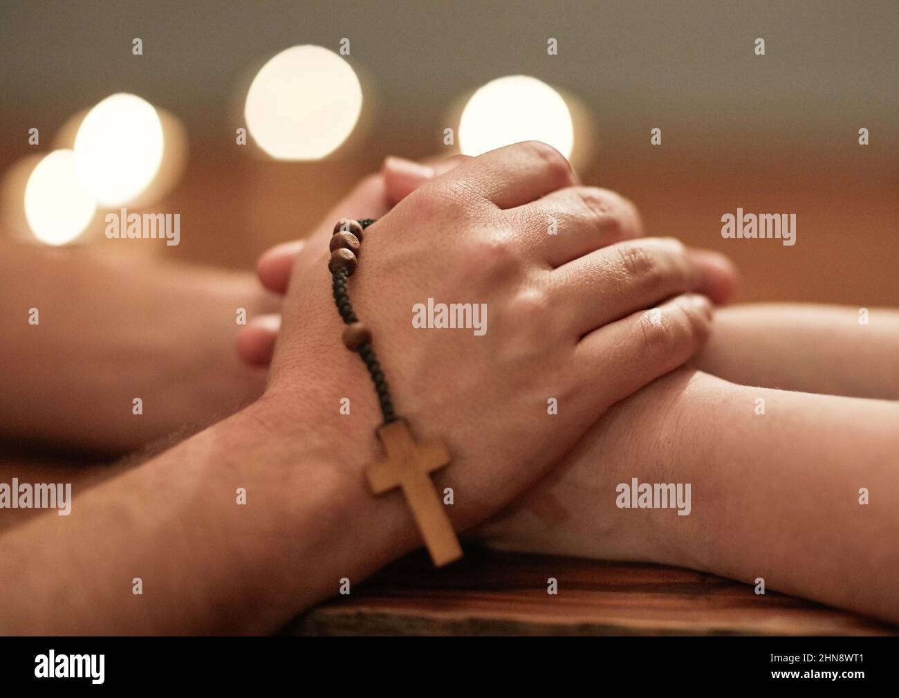 People Praying Together Holding Hands