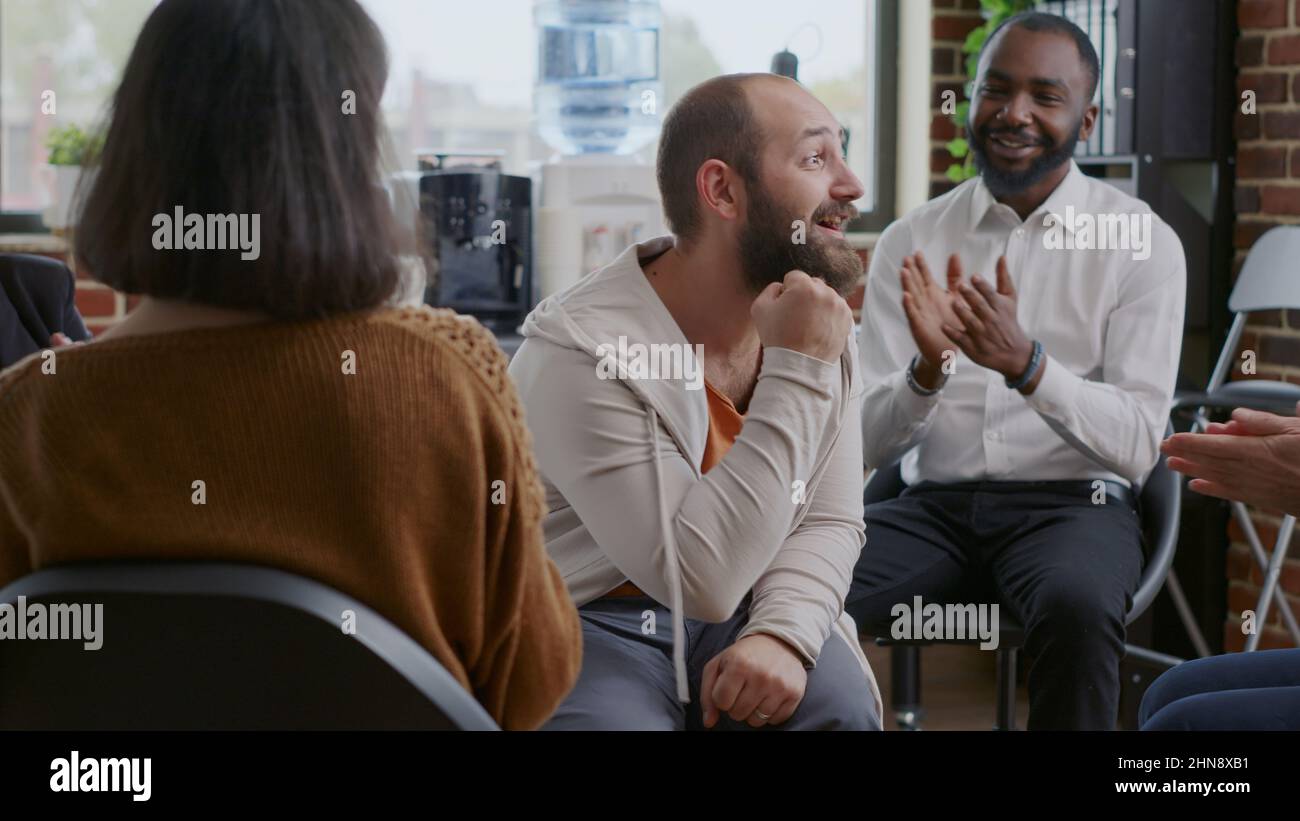 Man doing handshake with people after sharing progress and success at ...
