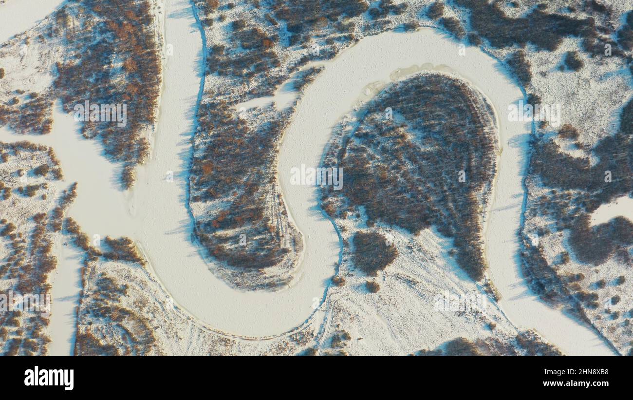 4K Beautiful Snowy White Forest And Curved Frozen Snow Covered River In ...