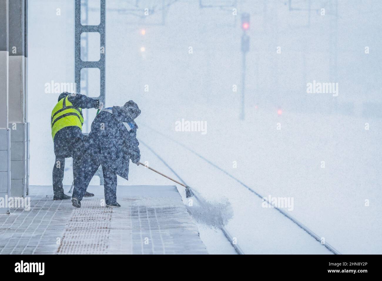 Men clean the station platform Stock Photo - Alamy