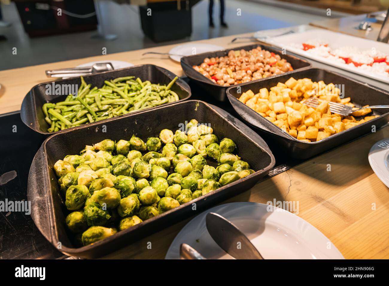 Self-service buffet in the hotel where visitors collect food from open ...