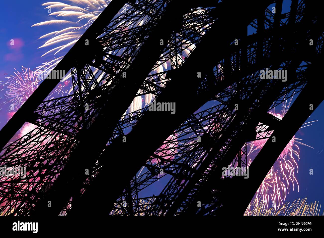 Celebratory colorful fireworks over the Eiffel Tower in Paris, France ...