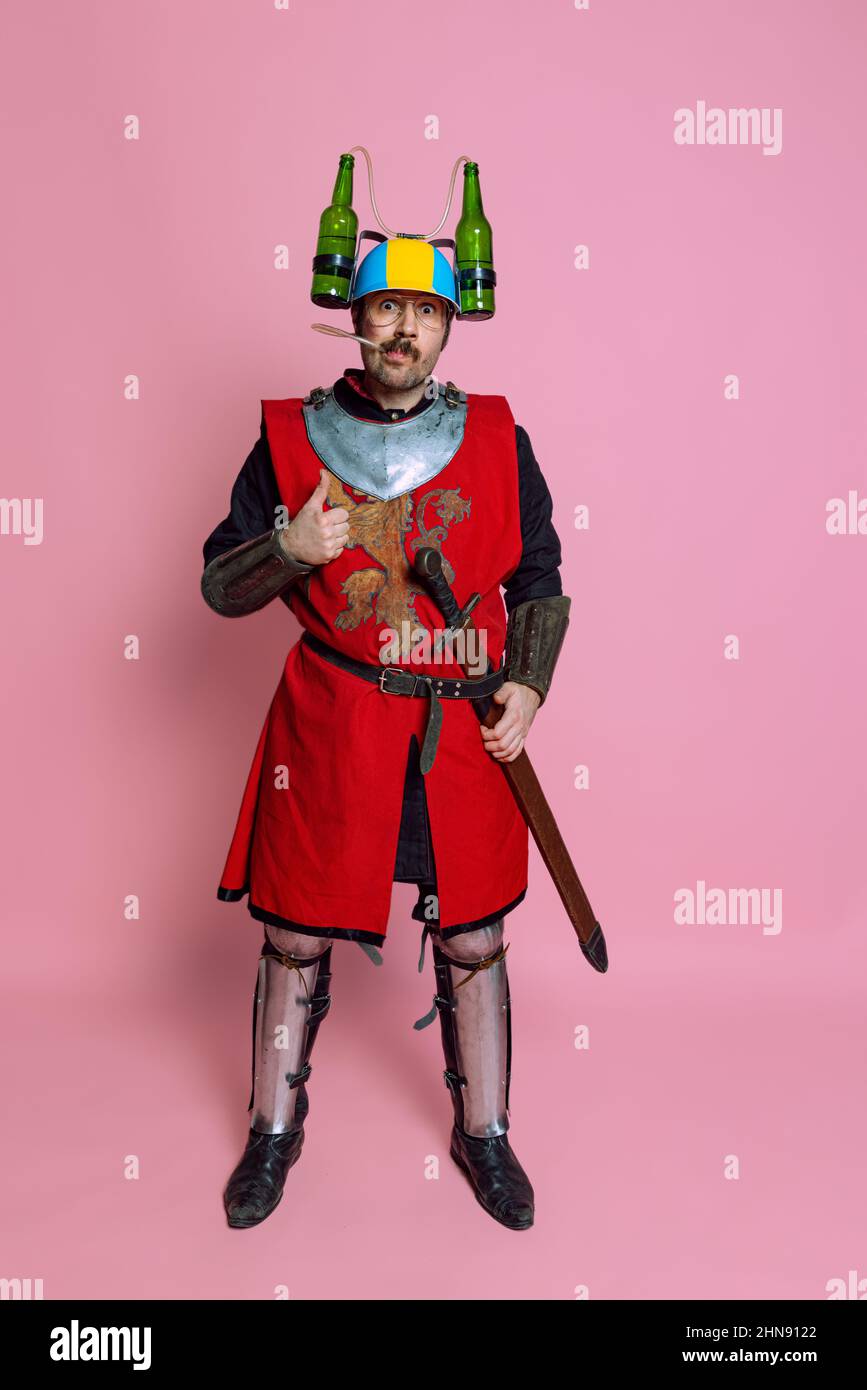 Full-length portrait of funny looking man, medieval warrior or knight ...