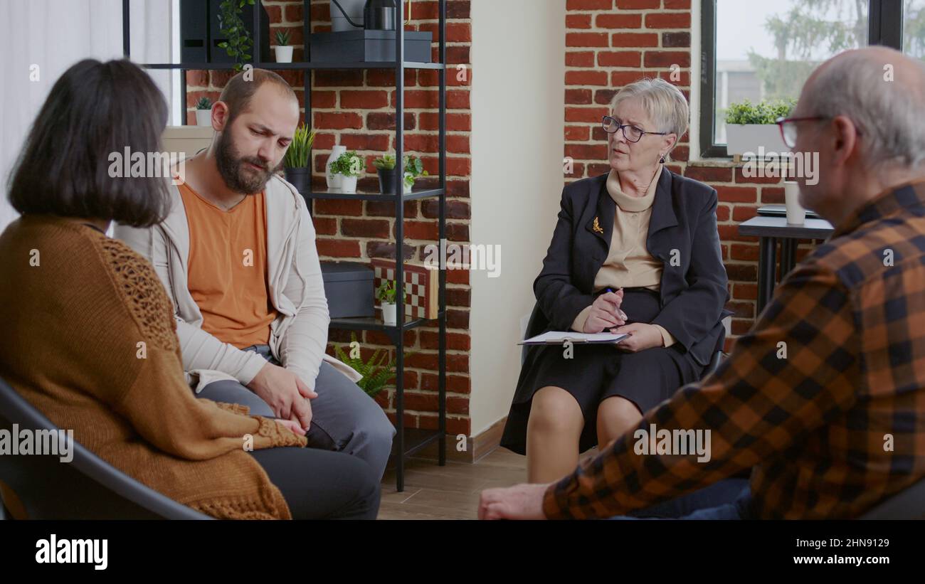Man with depression making confession at aa therapy meeting with ...