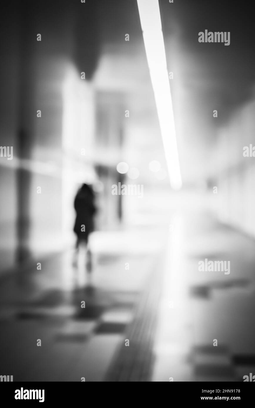 Blurry human silhouette in a subway. Moving human silhouettes in blur ...