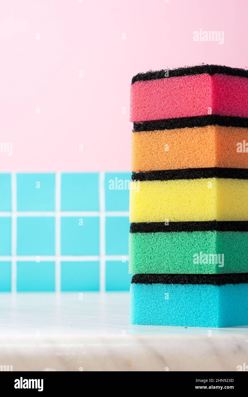 Colorful cleaning sponge on kitchen counter. Copy space background for ...