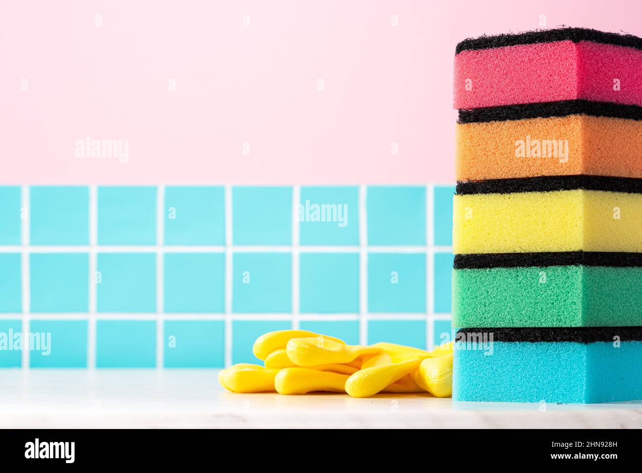 Colorful cleaning sponge on kitchen counter. Copy space background for ...