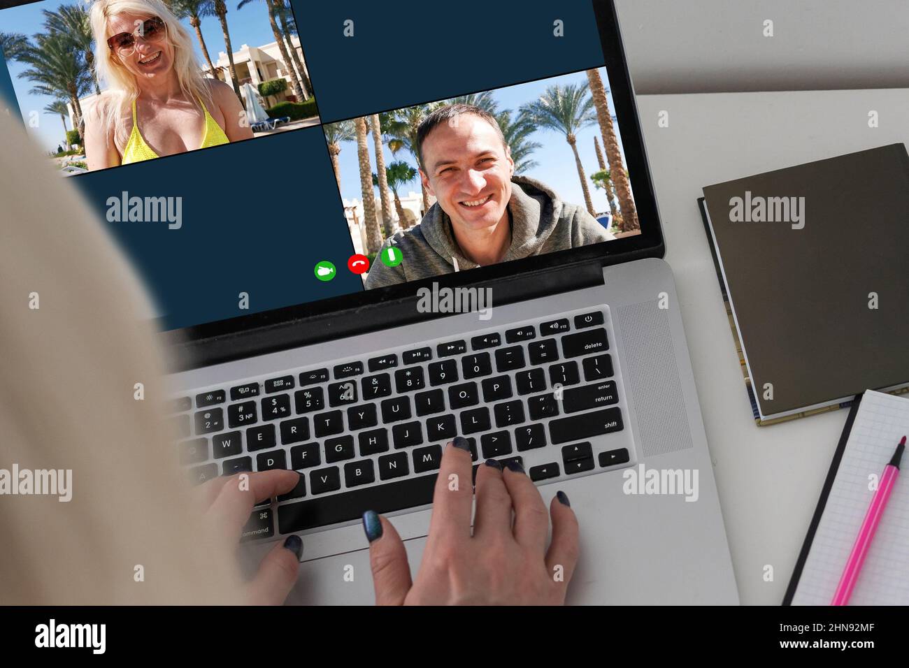 Virtual meeting with a friends. A guy is using laptop for video call ...