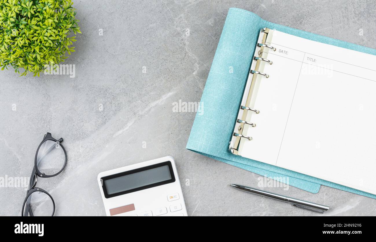 Open blue notebook office desk Stock Photo - Alamy