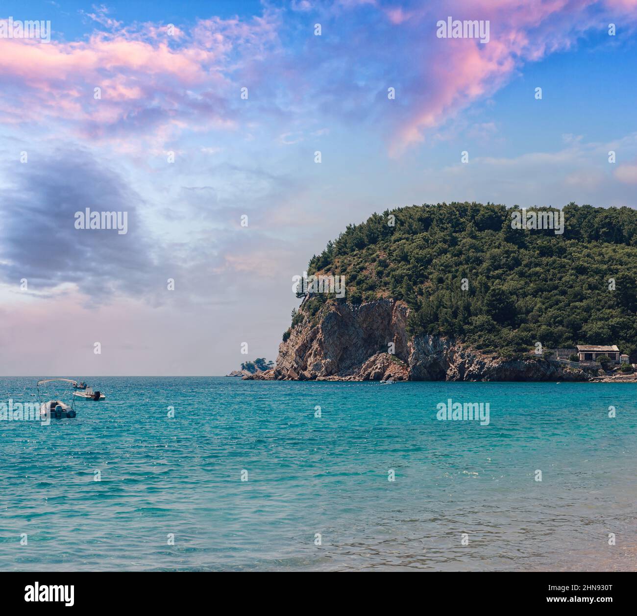 Picturesque view on rocks on a sunny day from the sea. Budva riviera ...