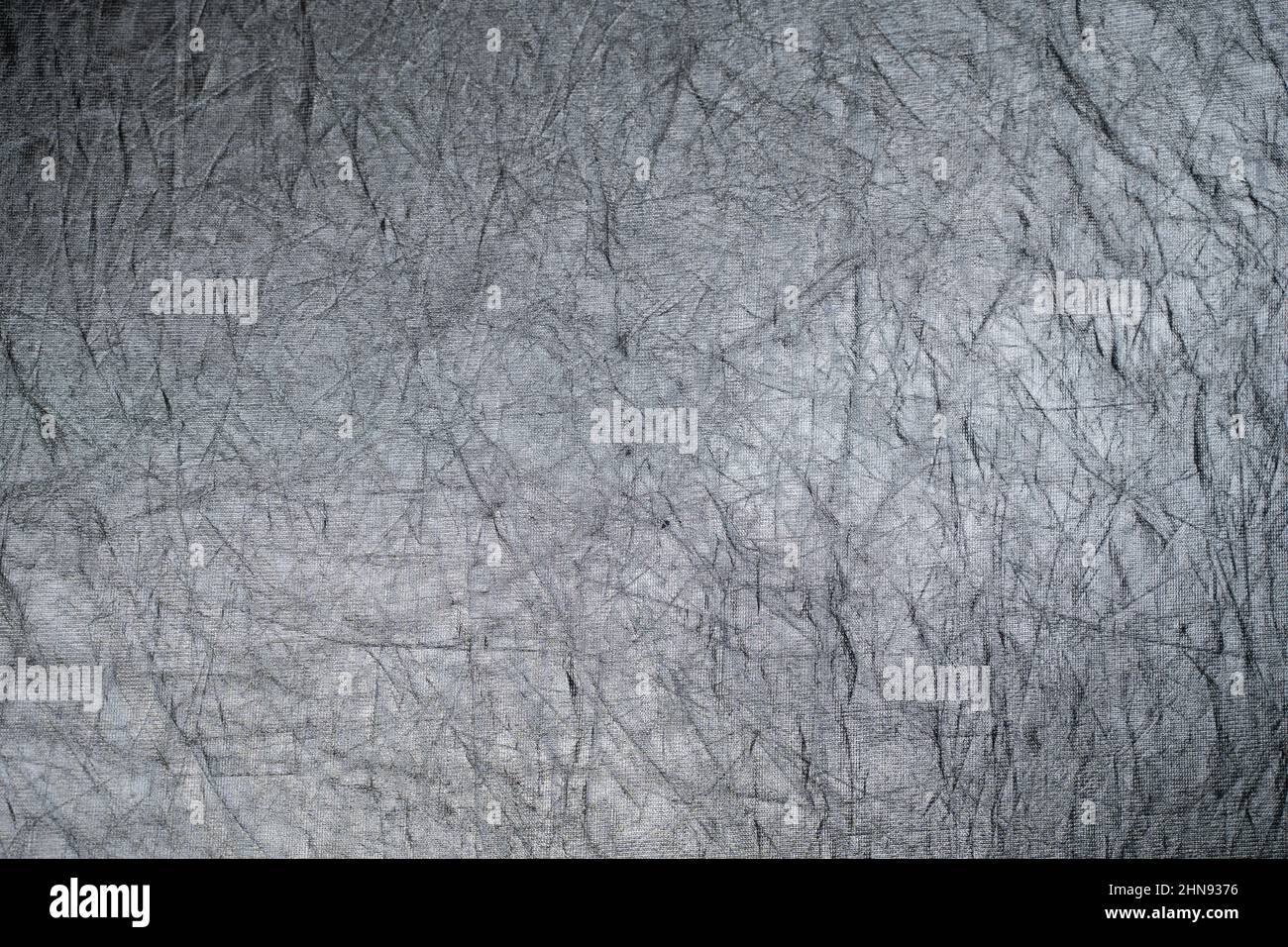 a wrinkled silver shiny textured reflector background Stock Photo - Alamy