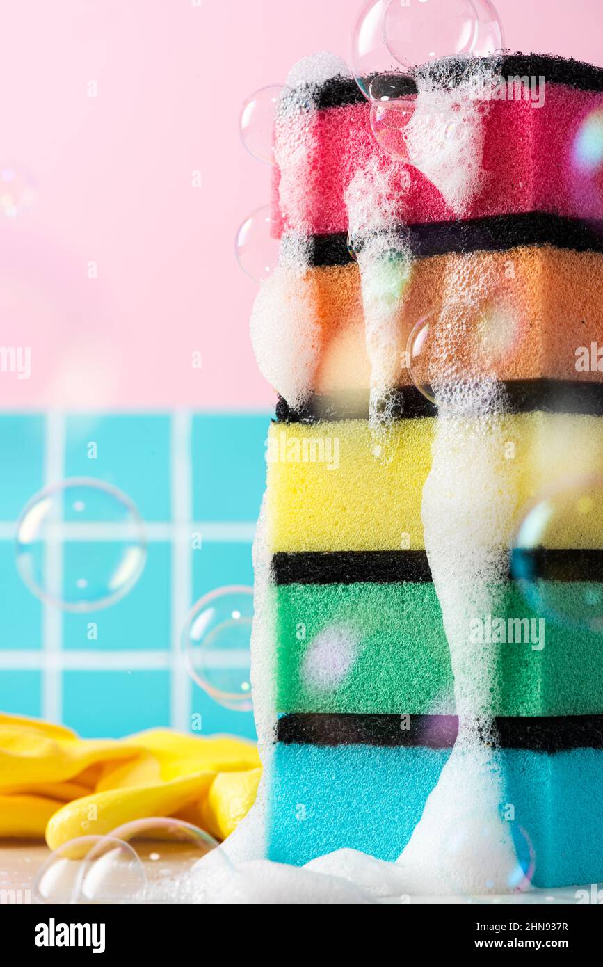 Colorful cleaning sponge on kitchen counter. Copy space background for ...