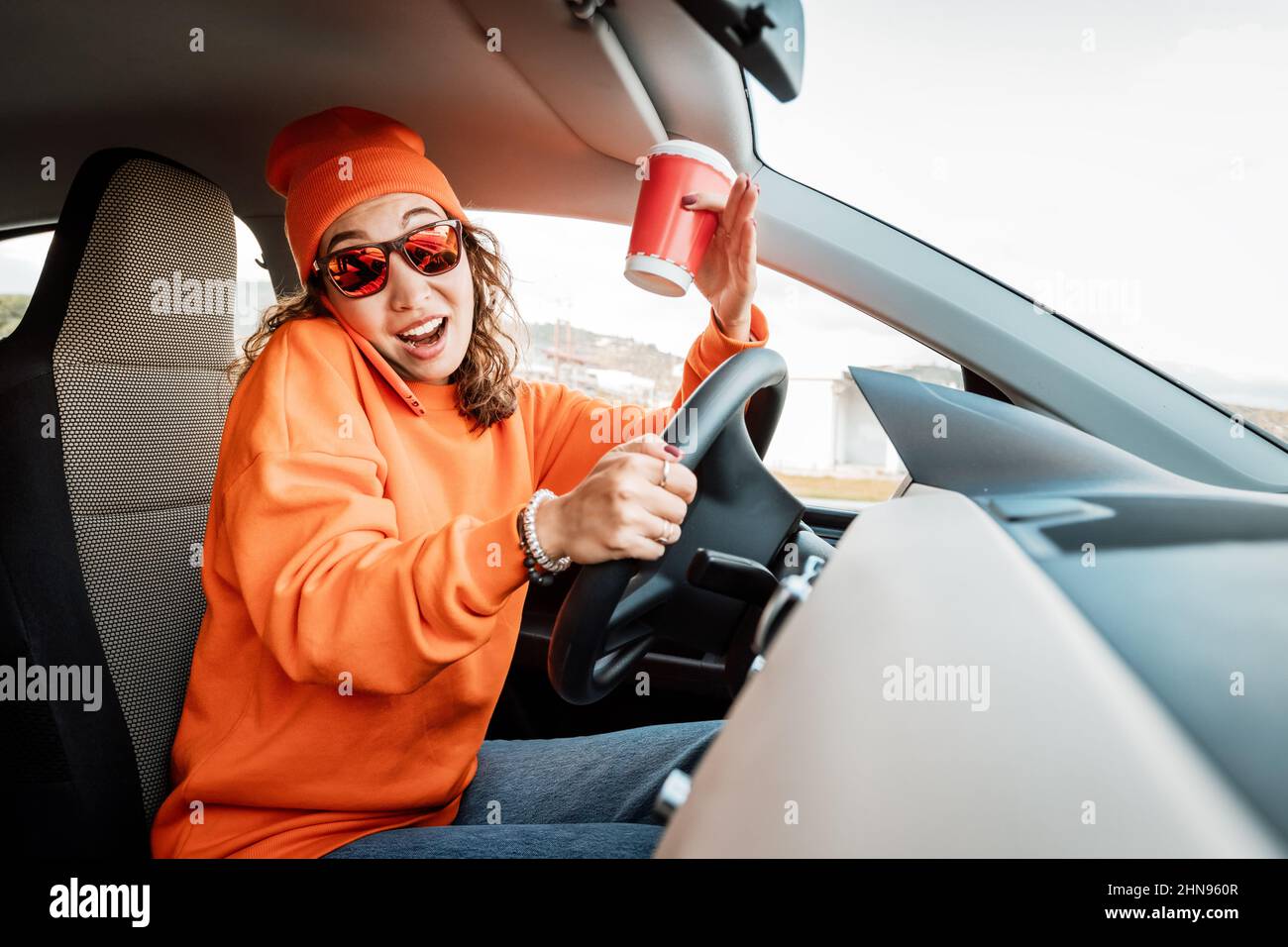 A young student girl was distracted by a coffee drink and talking with ...