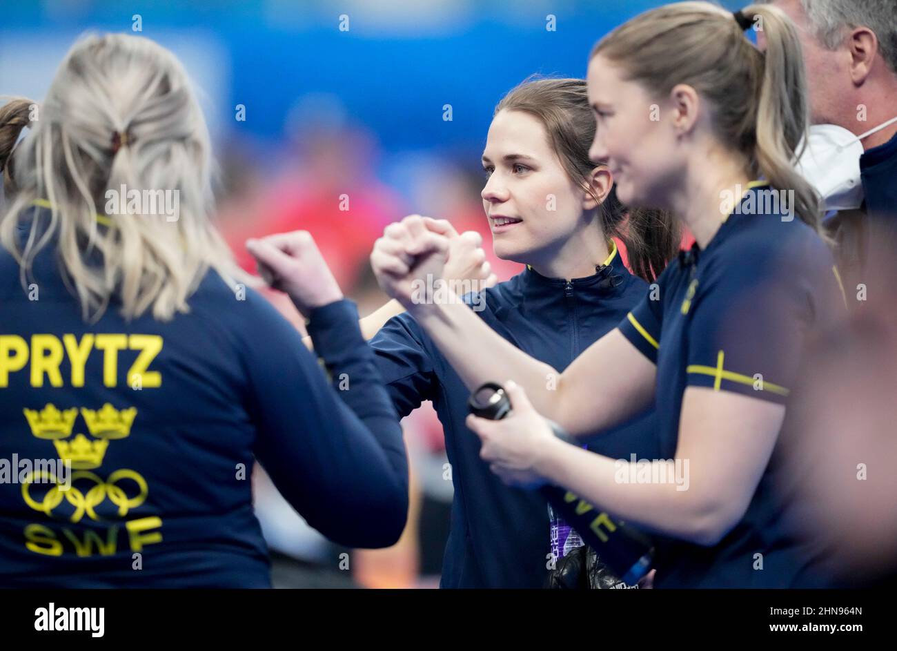 Beijing, China. 15th Feb, 2022. Anna Hasselborg (C) of Sweden reacts ...