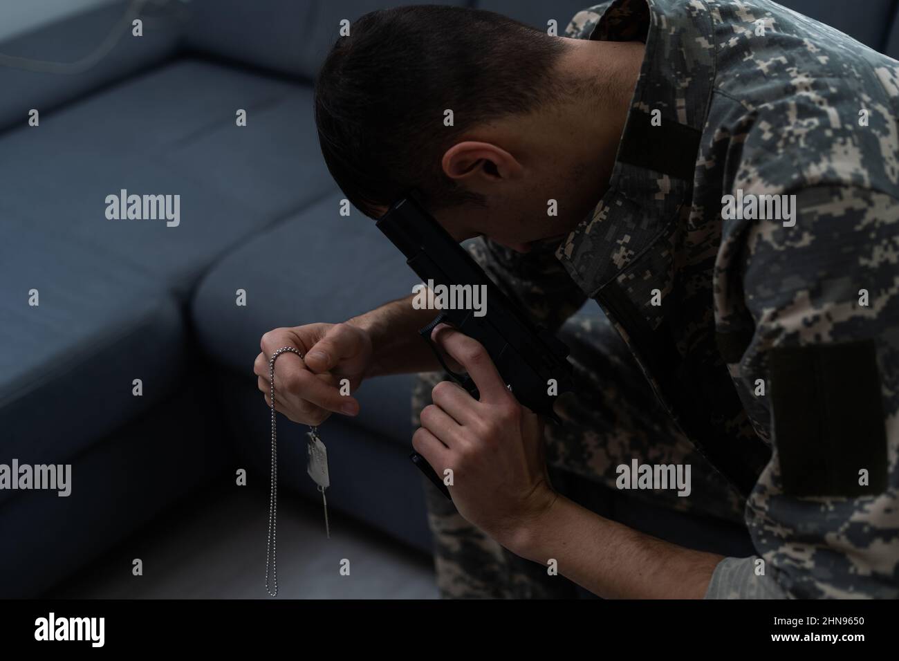 military with sadness and with a gun Stock Photo - Alamy