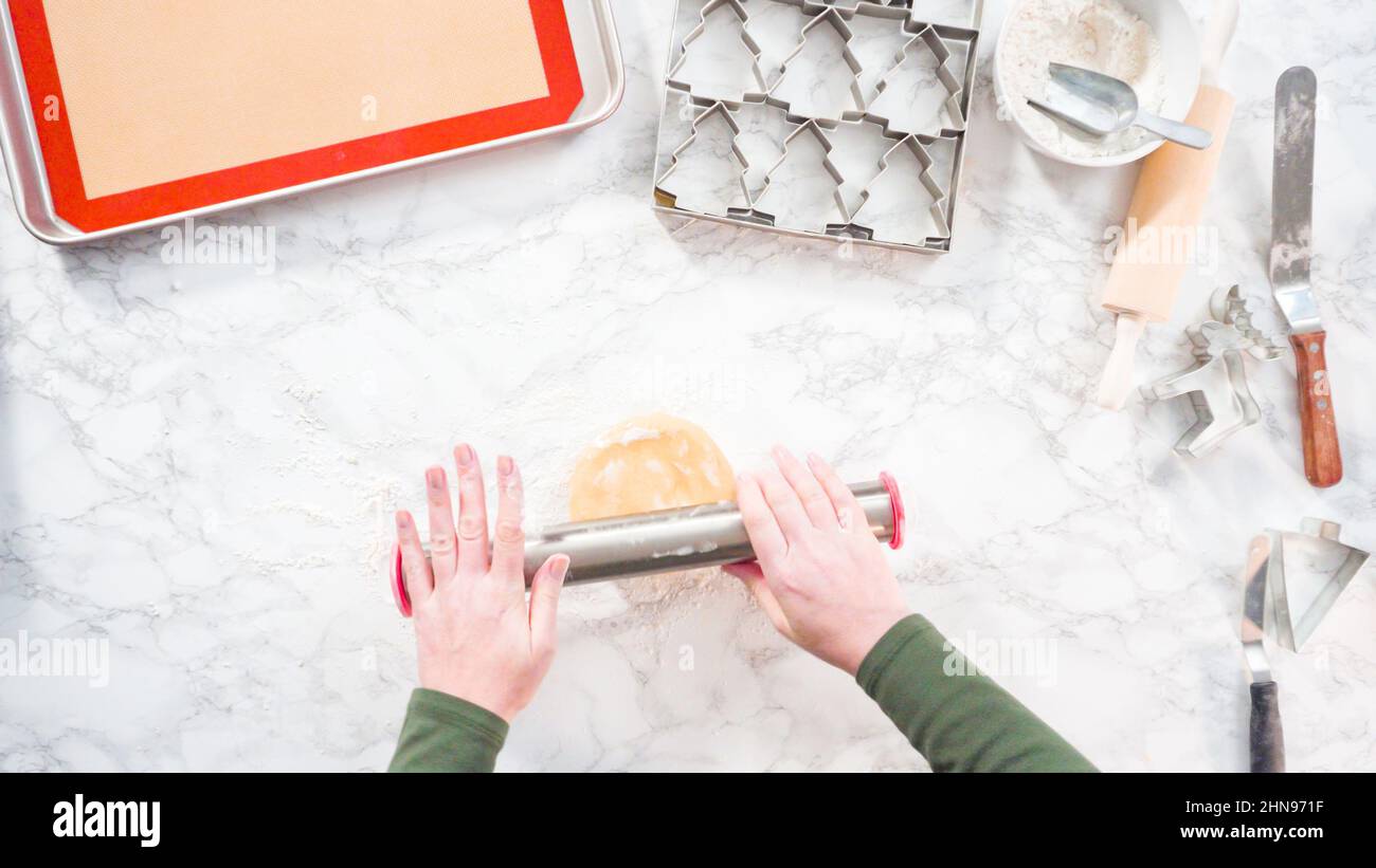 Flat lay. Step by step. Rolling out sugar cookie dough to bake ...