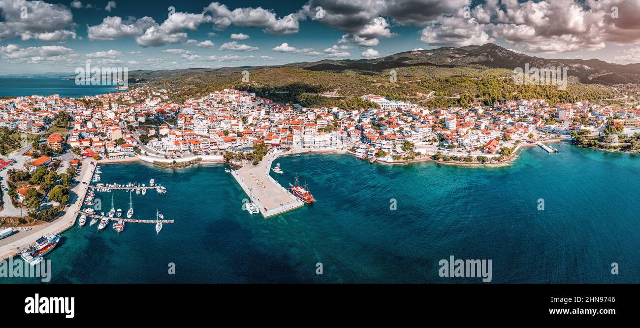 Aerial panorama of a scenic resort town Neos Marmaras with yacht marina ...