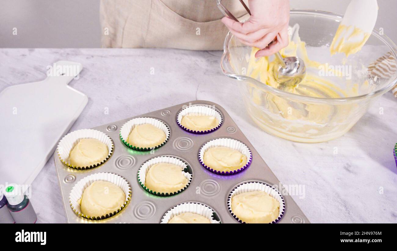 Step by step. Scooping cupcake batter into a foil cupcake liners to ...