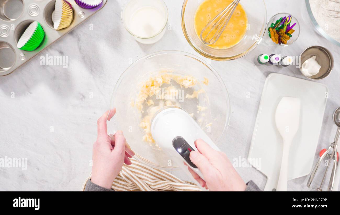 Flat lay. Step by step. Mixing ingredient in a mixing bowl with an ...