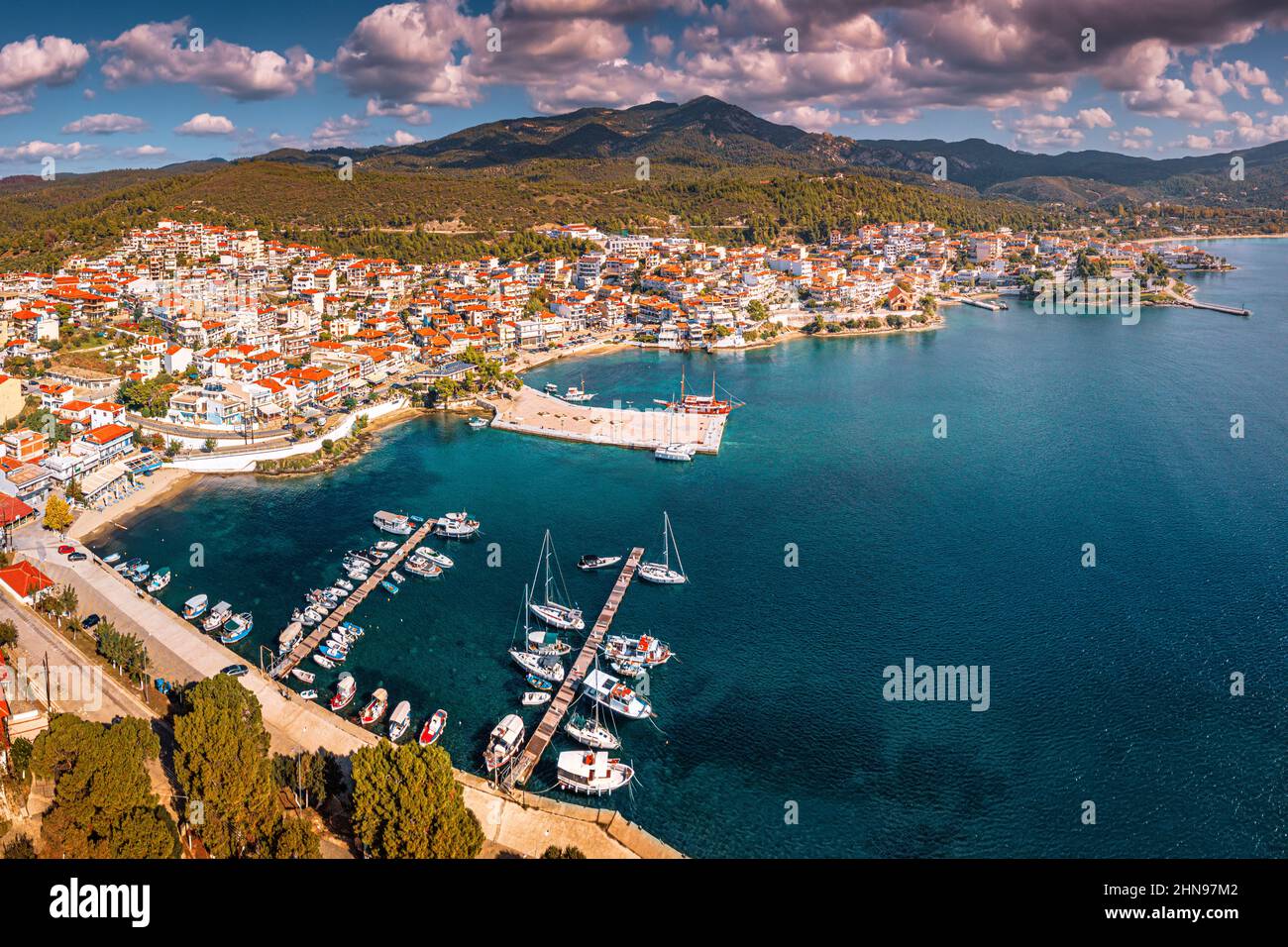 Wide aerial panoramic view of a resort sea town Neos Marmaras with ...