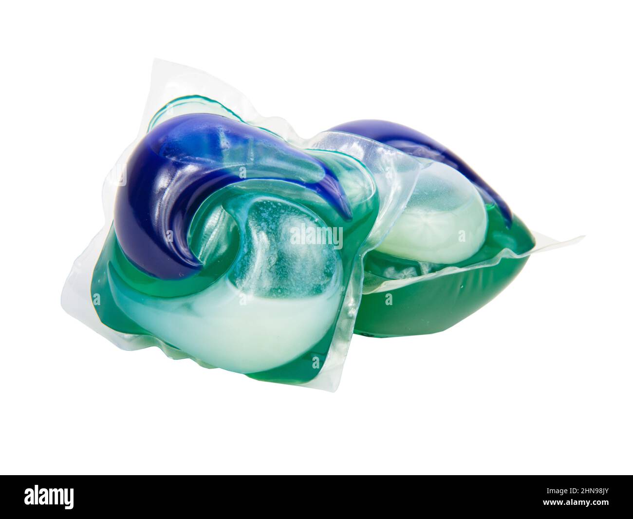 Blue green gel capsules for washing clothes isolated on the white ...