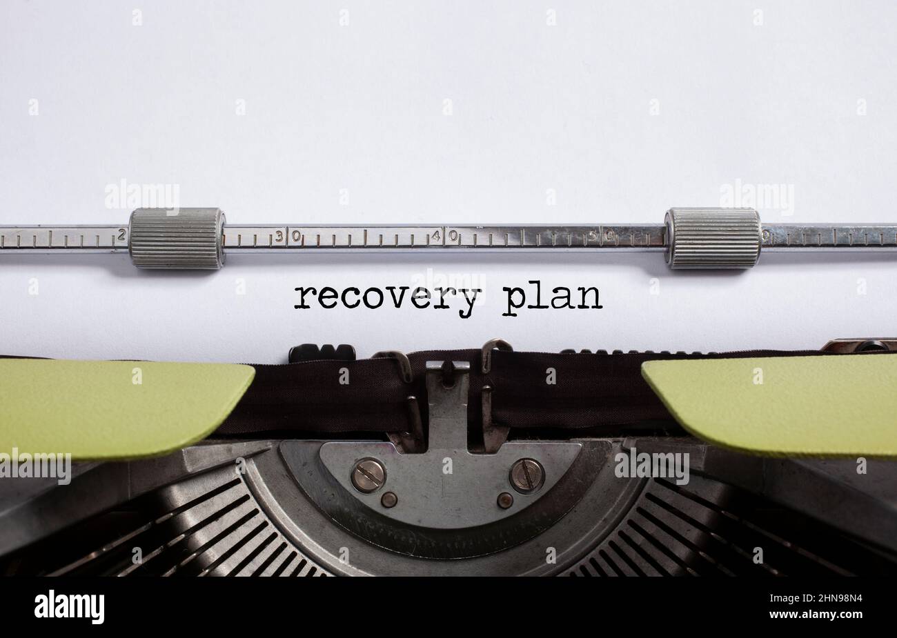 RECOVERY PLAN inscription on white paper with typewriter Stock Photo ...