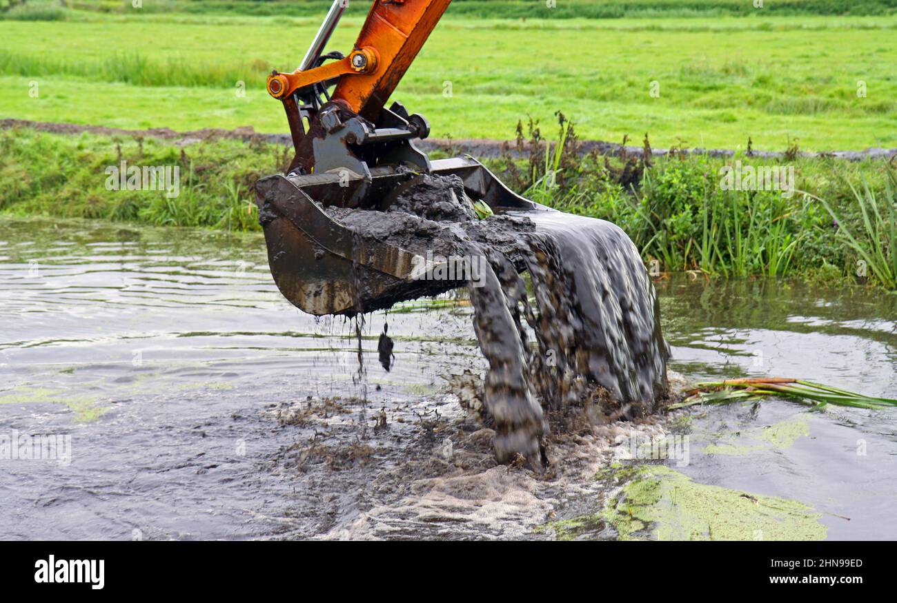 Small scale inland dredging works Stock Photo - Alamy