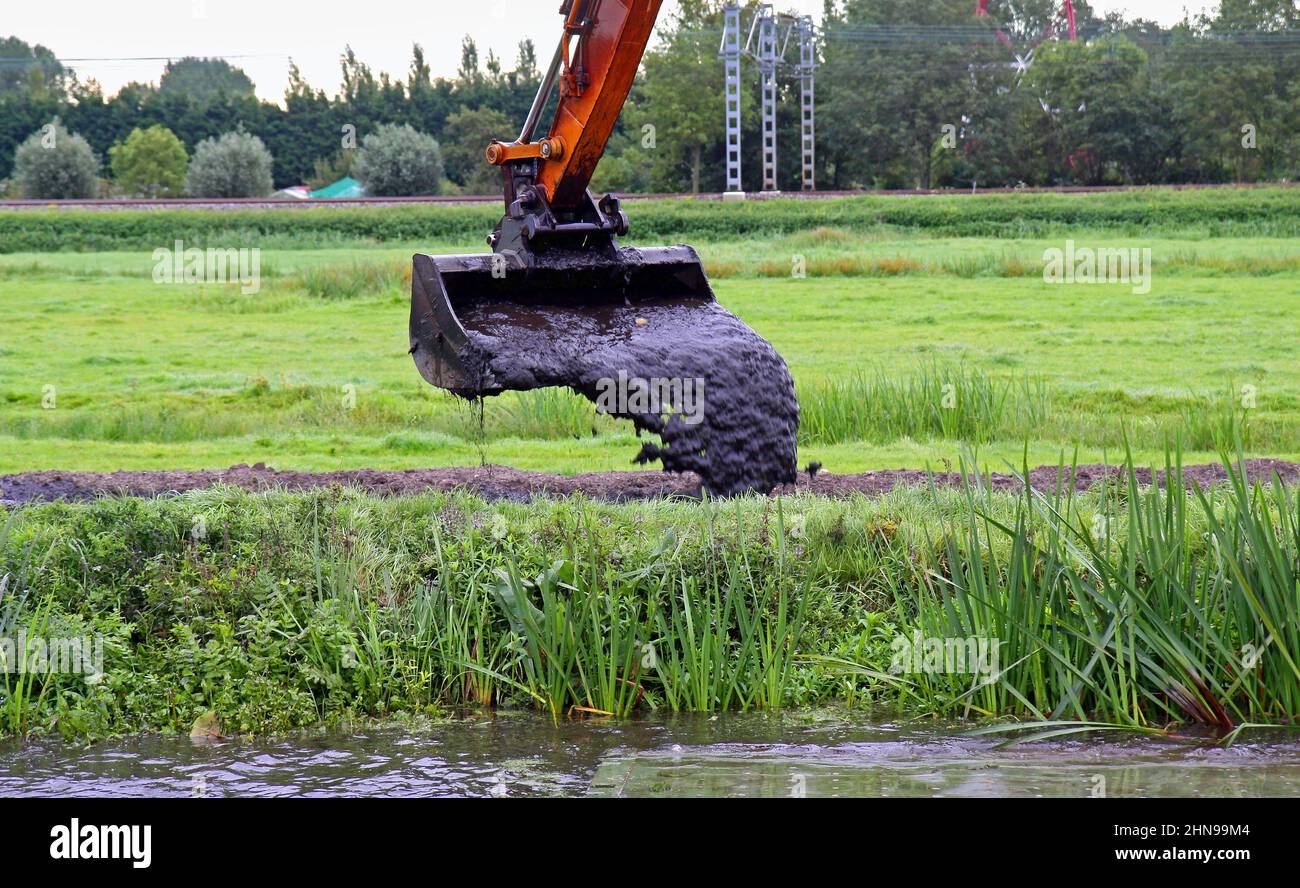 Small scale inland dredging works Stock Photo - Alamy
