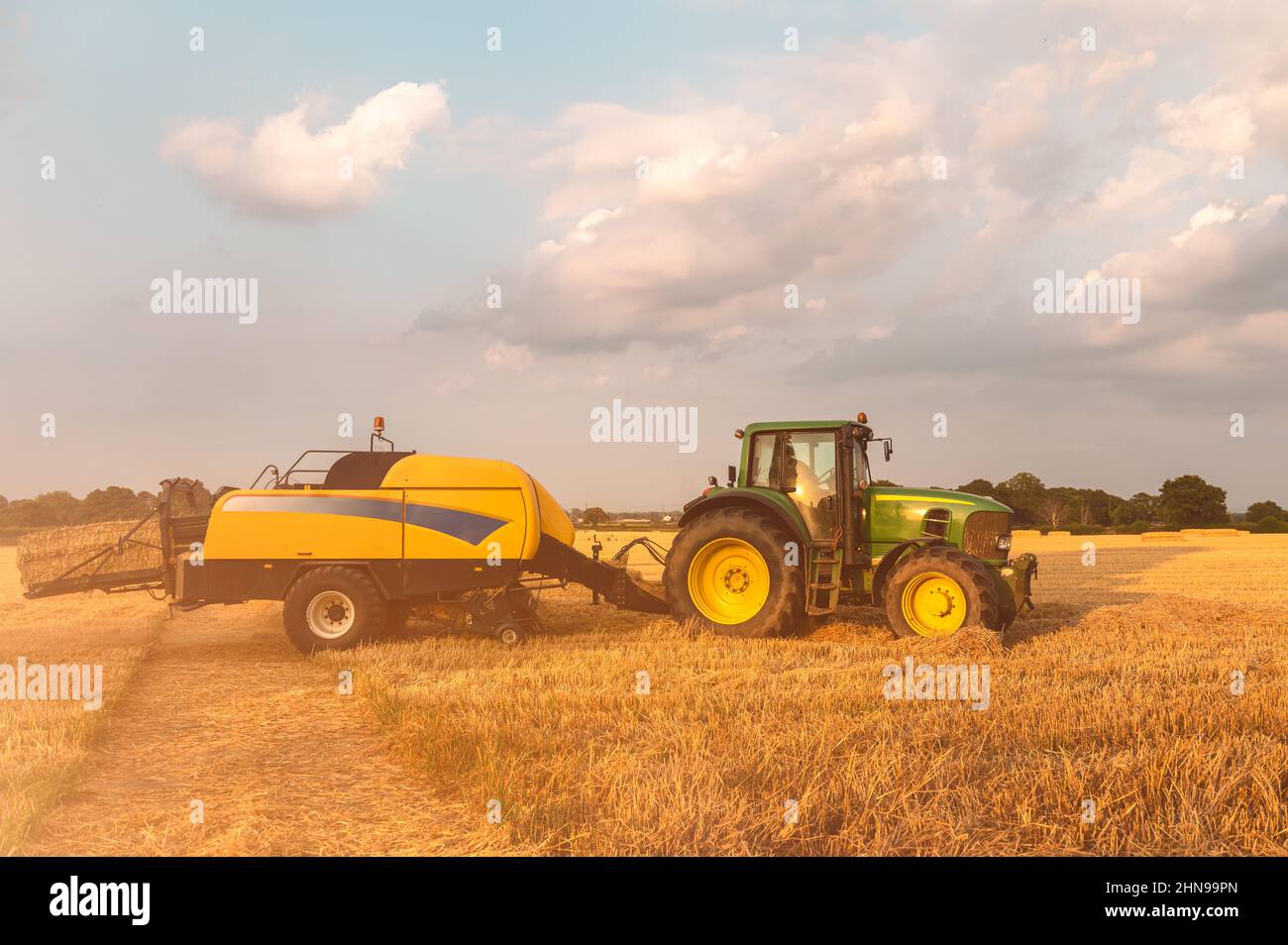 Process of hay making during harvesting Stock Photo - Alamy