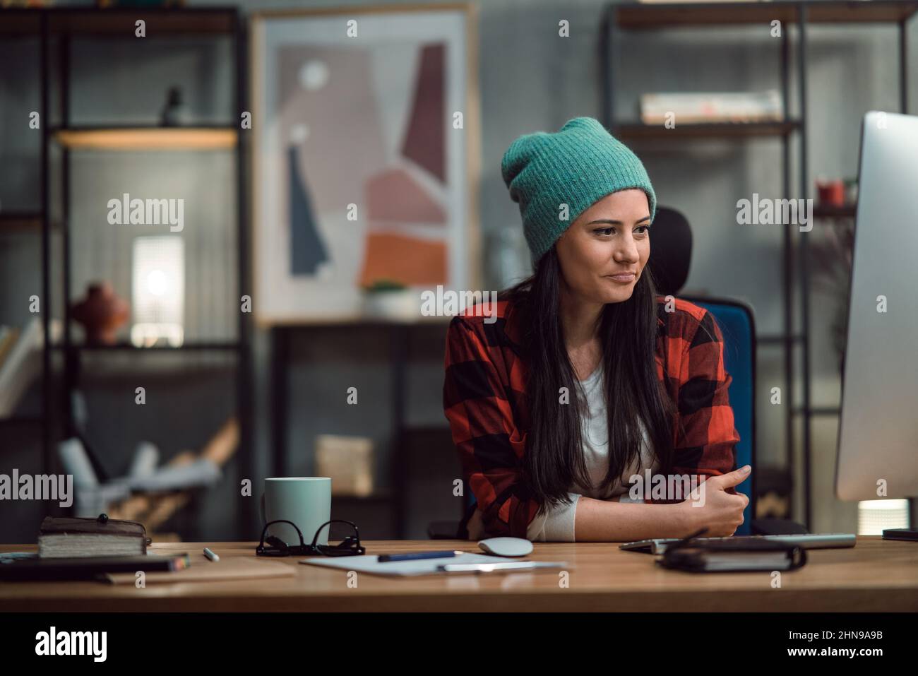 Female video editor works indoors in creative office studio Stock Photo ...