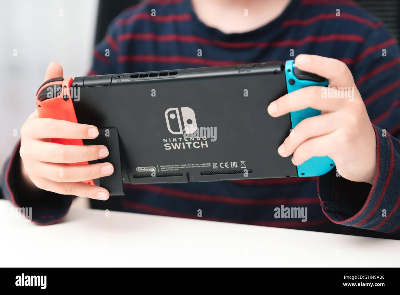 Wroclaw, Poland - JAN 27, 2022: Boy plays Nintendo Switch console ...