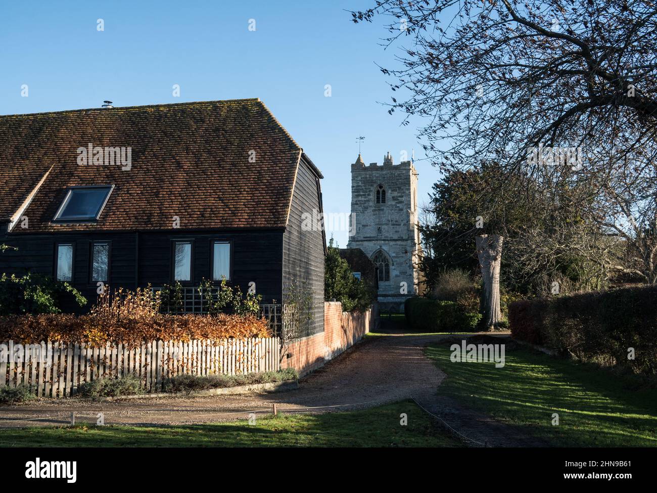 Converted barn with St. Andrew's church in background, East Hagbourne ...