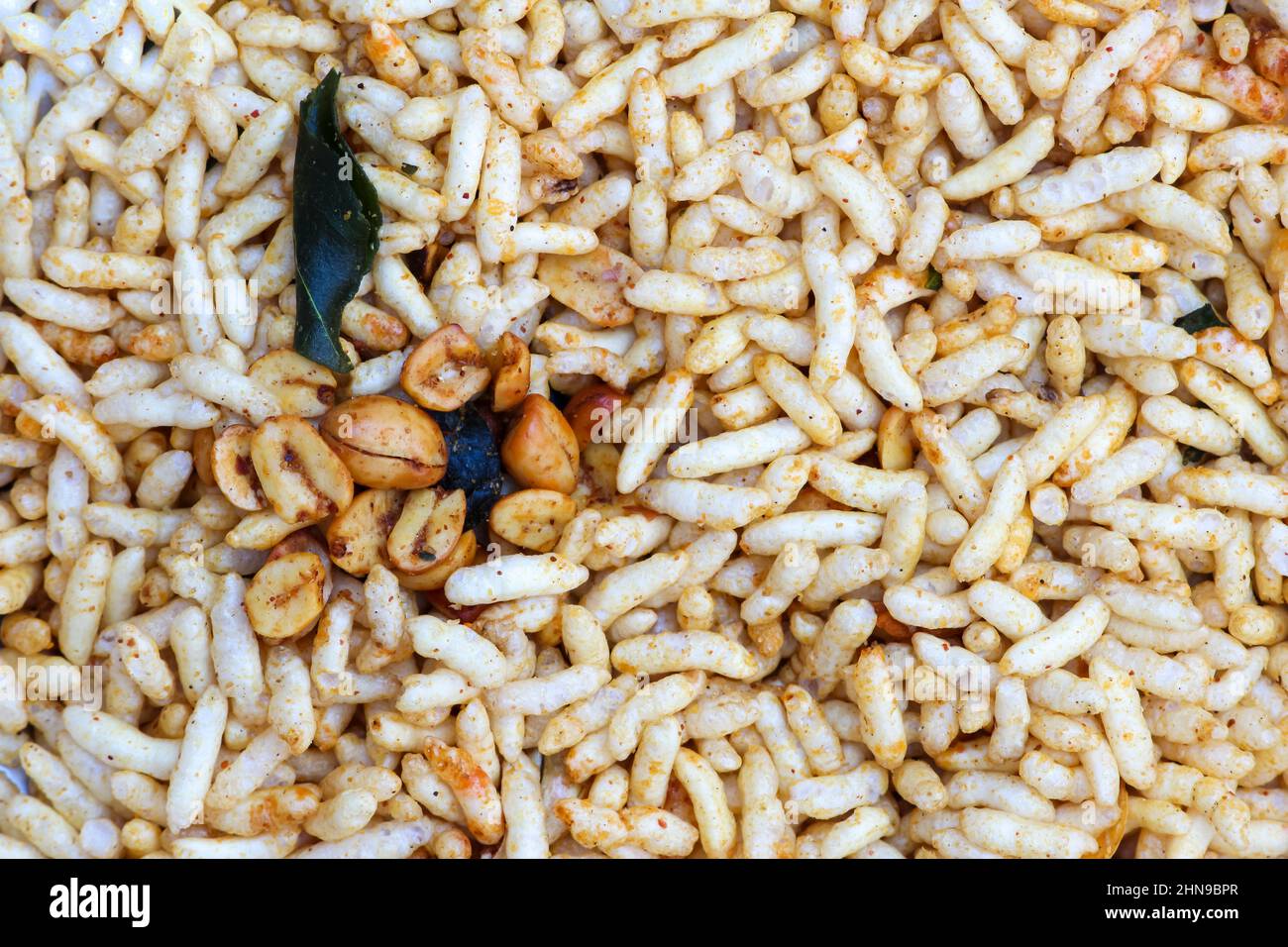 Spicy puffed rice (also known as muri, porri) along with spcied peanuts ...