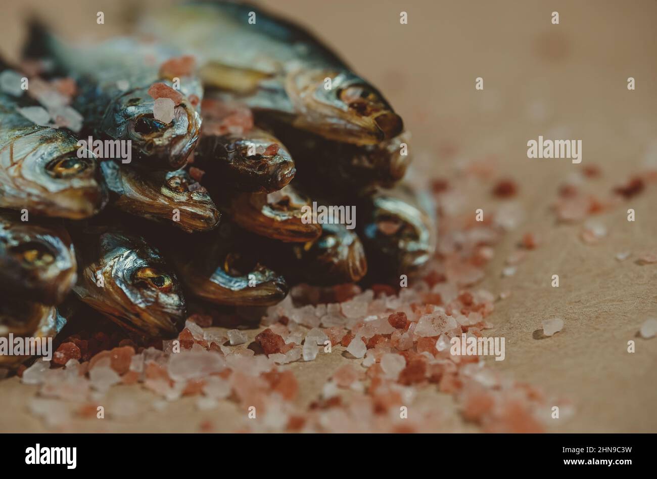 Lots of sun dried fish on the paper Stock Photo - Alamy
