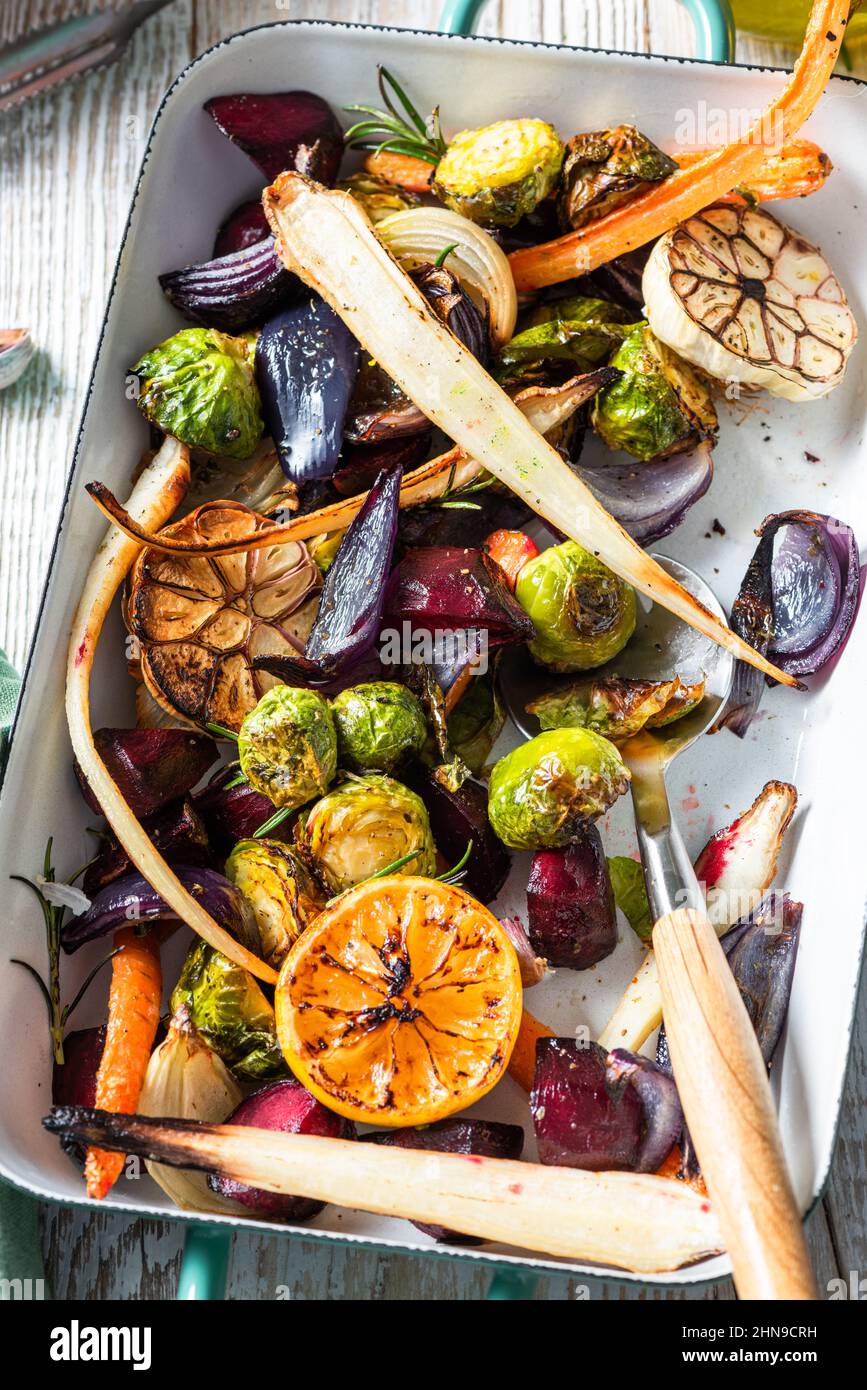 Mixed root vegetable roast with herbs. Healthy simple grill food Stock ...