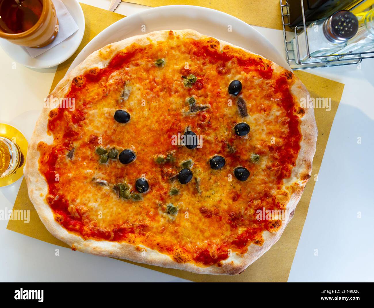 Roman pizza with olives, variant of classic Italian pizza Stock Photo ...
