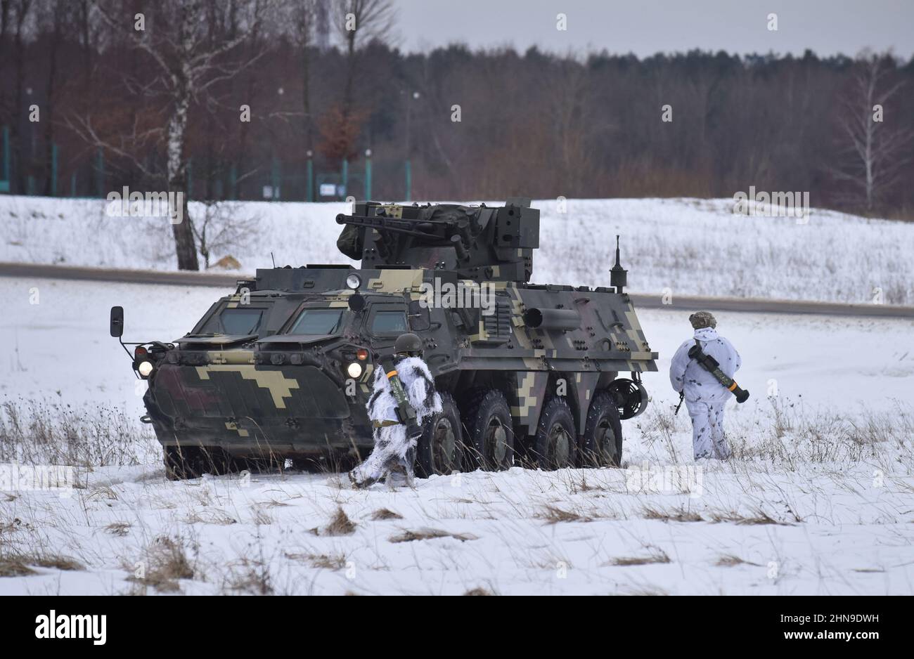 February 4, 2022, Lviv, Ukraine: Ukrainian military walk next the BTR-4 ...