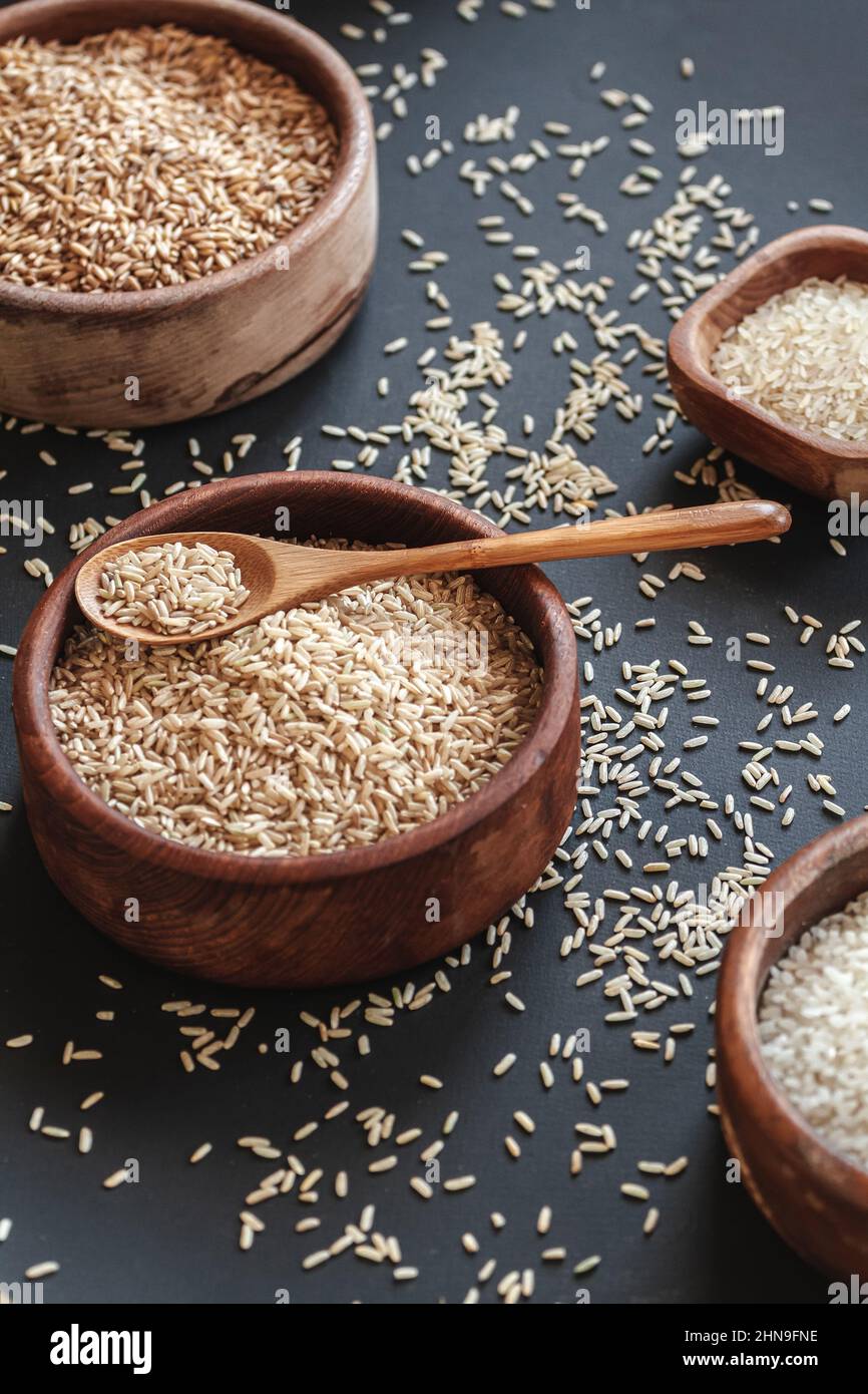 Set of different types of rice and cereals in wooden bowls and Stock ...