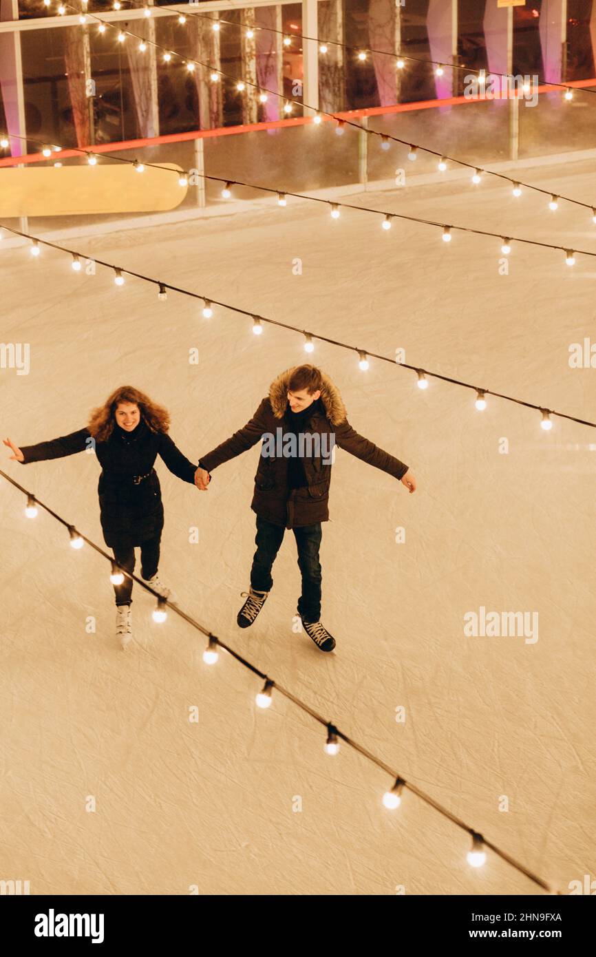 Holding hands ice skating hi-res stock photography and images - Alamy
